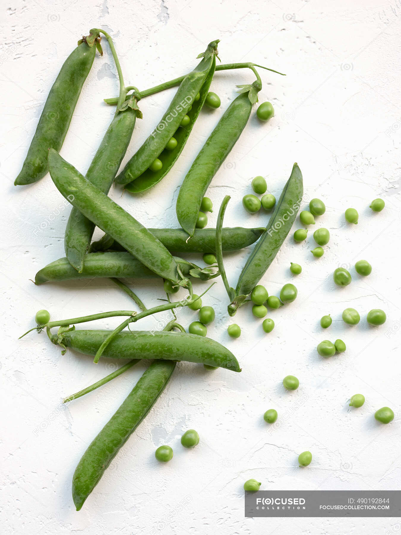 Green peas on a white background — pea pod, pod - Stock Photo | #490192844