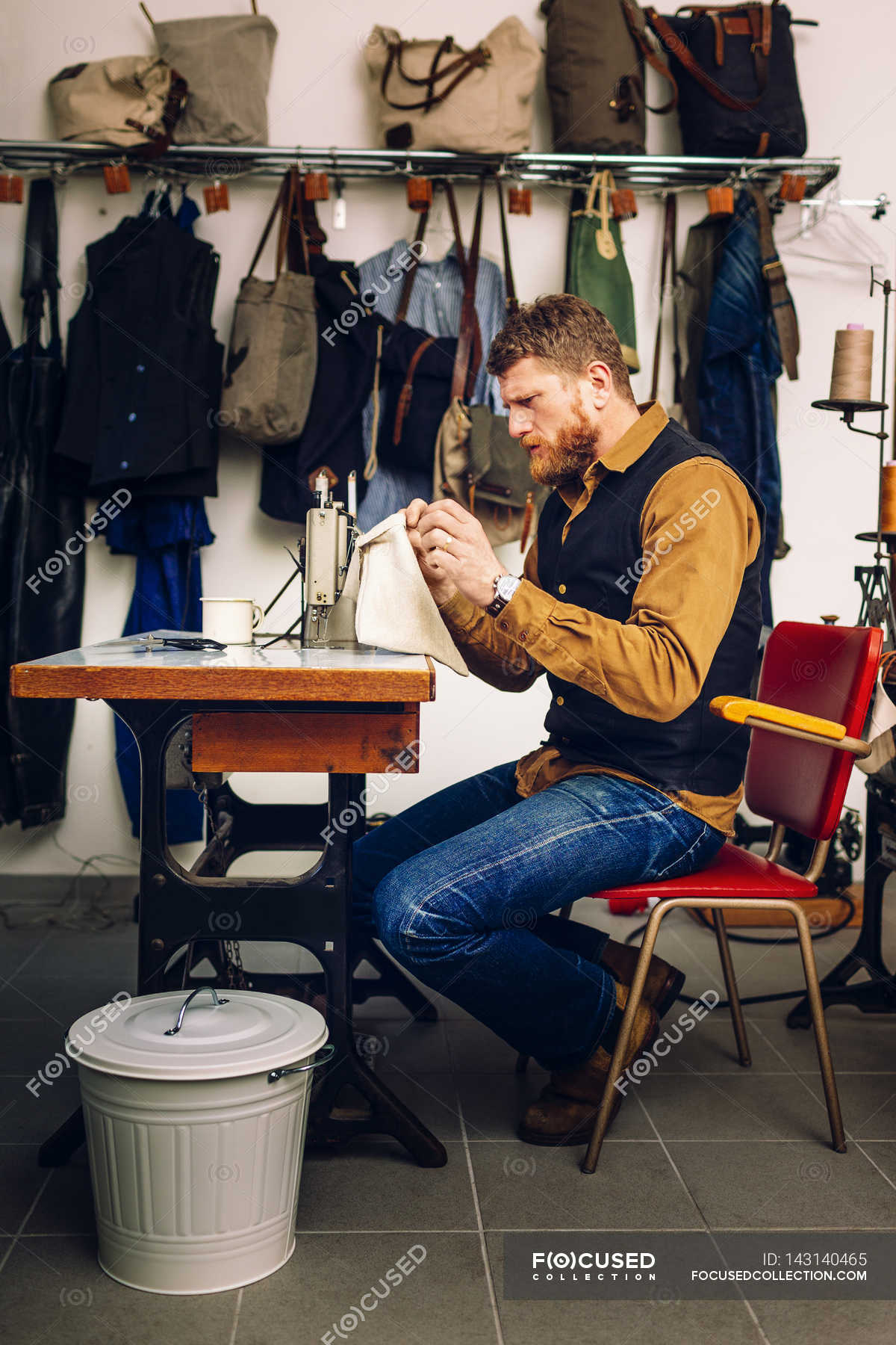 Worker analyzing bag pocket — manufacturing, occupation - Stock Photo ... Worker analyzing bag pocket — manufacturing, occupation - Stock Photo ...