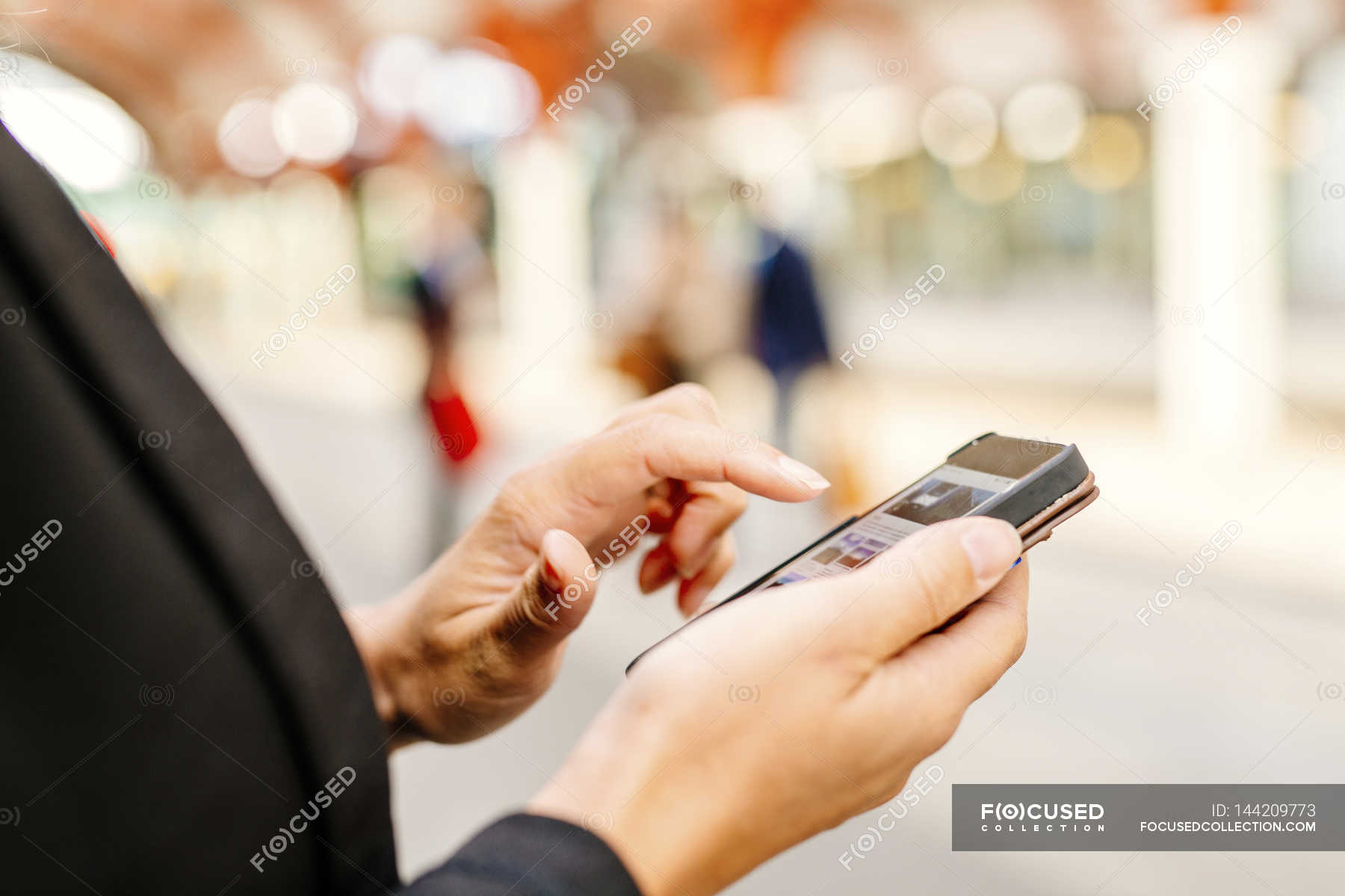 Businesswoman using smart phone — mode of transport, corporate business ... Businesswoman using smart phone — mode of transport, corporate business ...