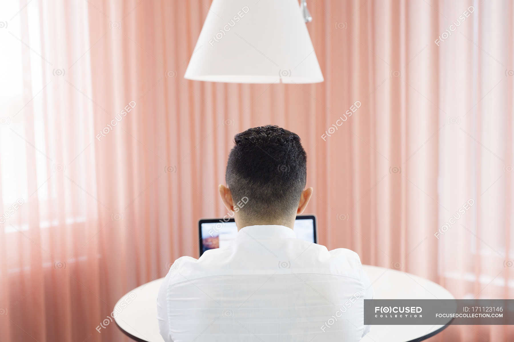 Man working at table — modern, busy - Stock Photo | #171123146