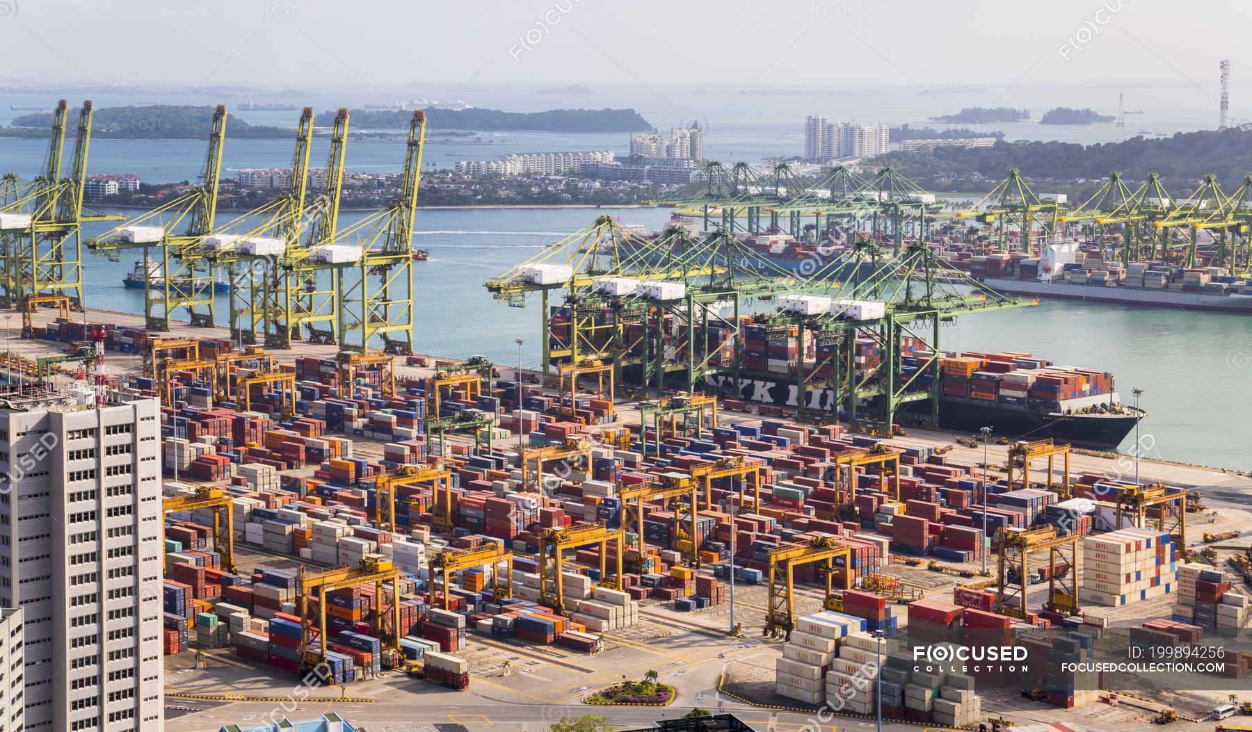 Elevated view of container terminal, cranes and container ship ... Elevated view of container terminal, cranes and container ship ...