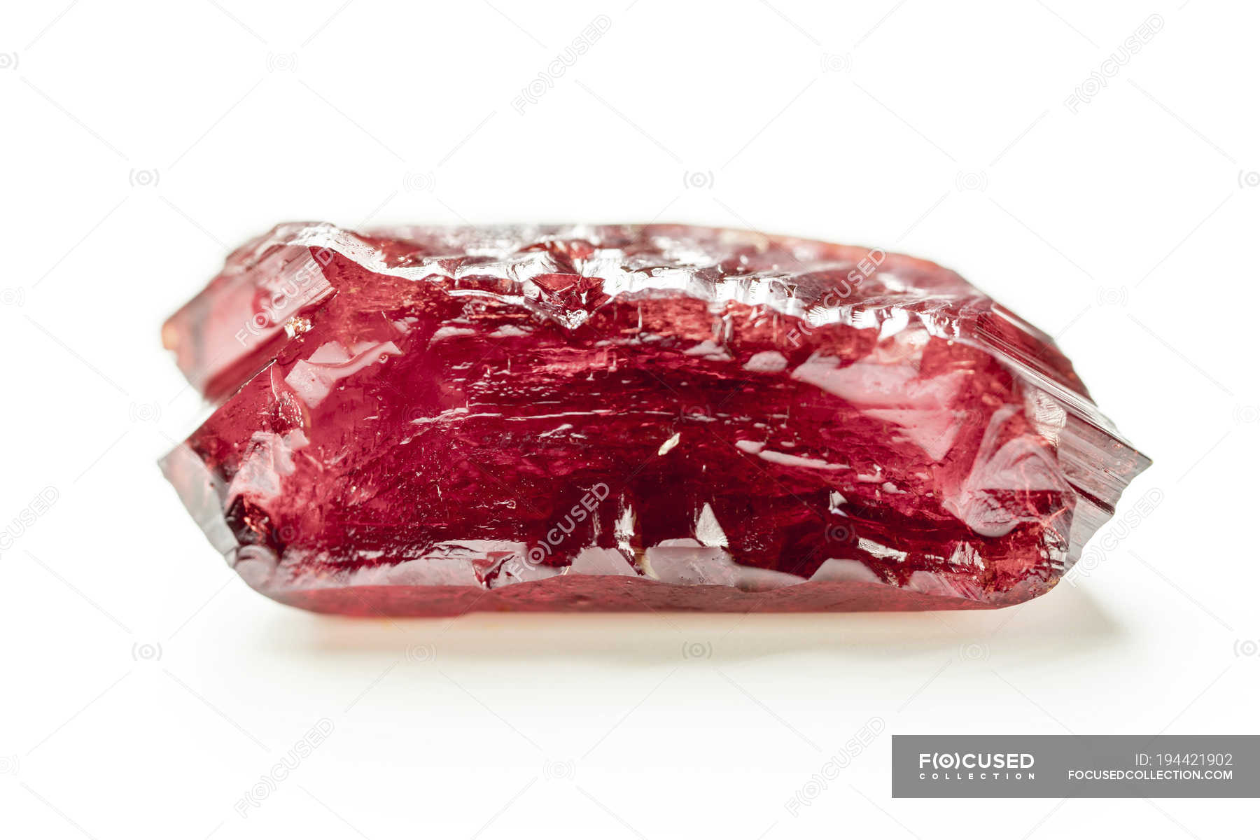 Shiny ruby gemstone on white background. — jewelry, selective focus ...