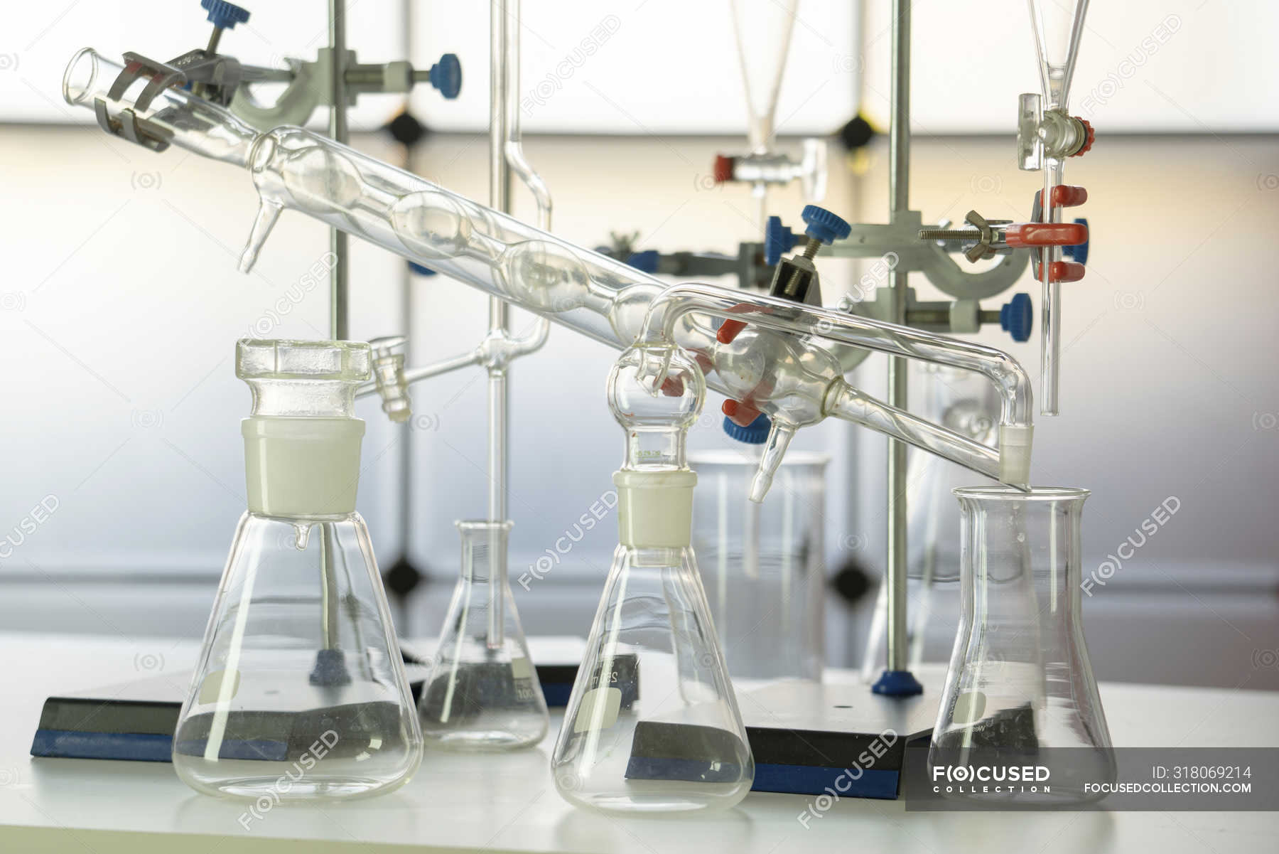Chemistry apparatus glassware on table in laboratory. — Flasks ...