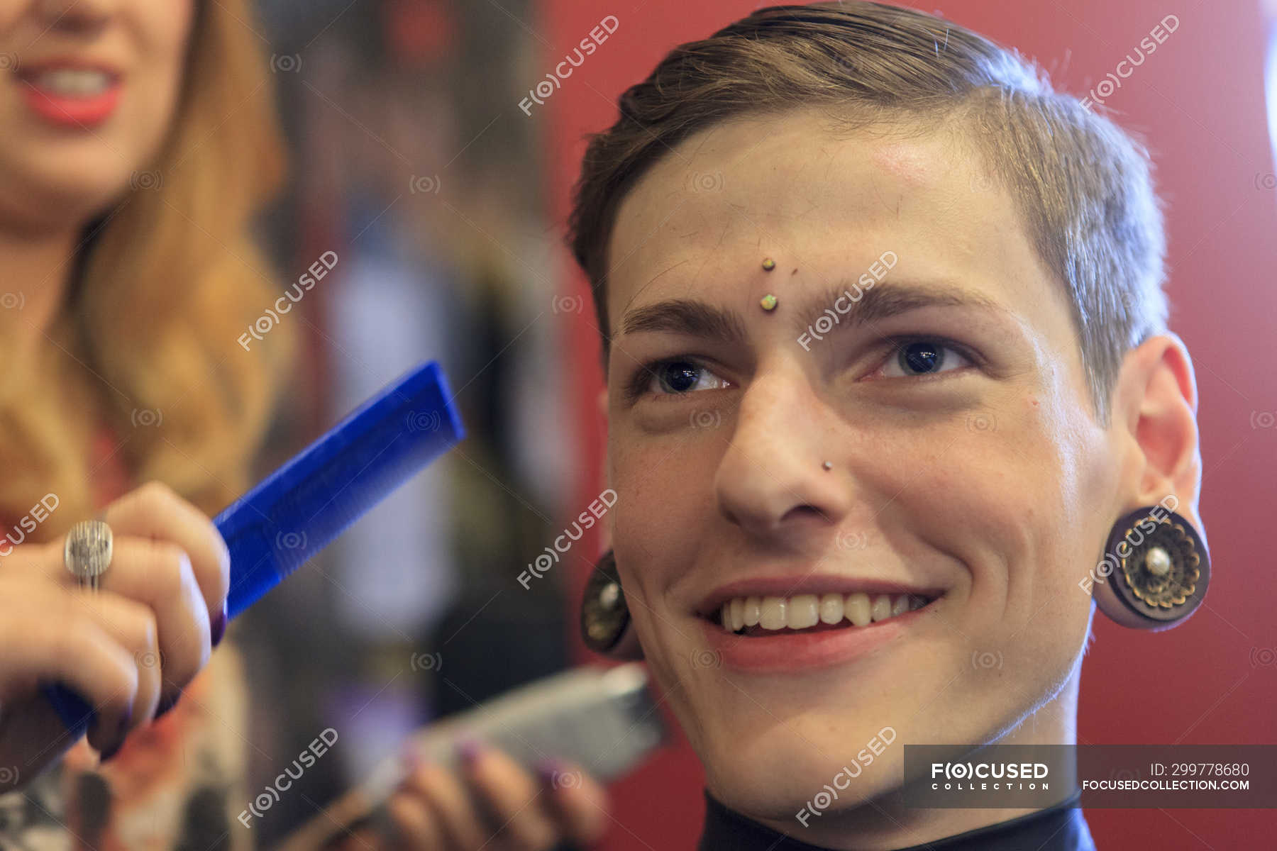 Trendy man with a spinal cord injury at a hair salon getting a hair cut ... Trendy man with a spinal cord injury at a hair salon getting a hair cut ...