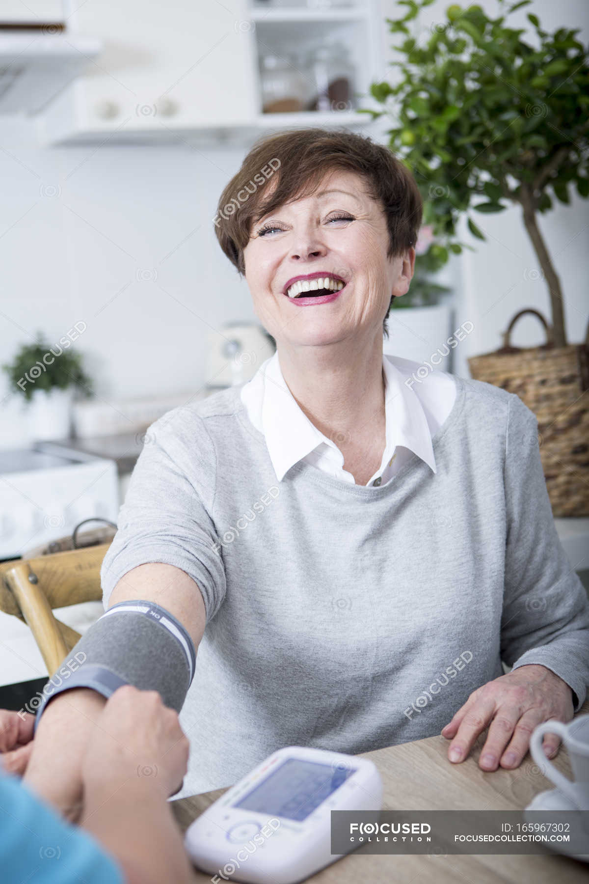 Nurse Measuring Blood Pressure Of Patient Illness Gereatric Stock nurse-measuring-blood-pressure-of-patient-illness-gereatric-stock