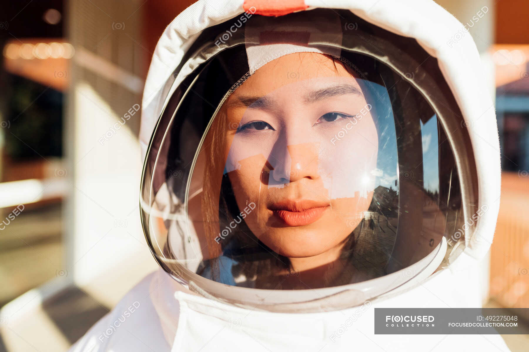 Serious Female Astronaut In Space Suit During Sunny Day Portrait serious-female-astronaut-in-space-suit-during-sunny-day-portrait
