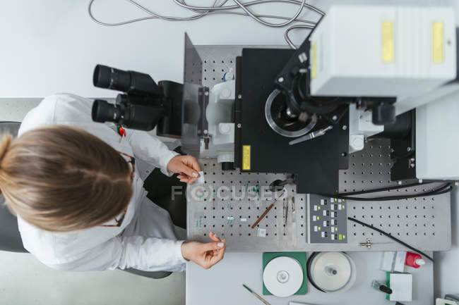 Technician working in modern lab — researching, scrutiny - Stock Photo ... Technician working in modern lab — researching, scrutiny - Stock Photo ...