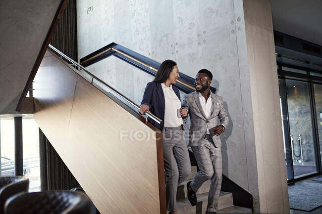 Walking down the stairs - Stock Photos, Royalty Free Images | Focused