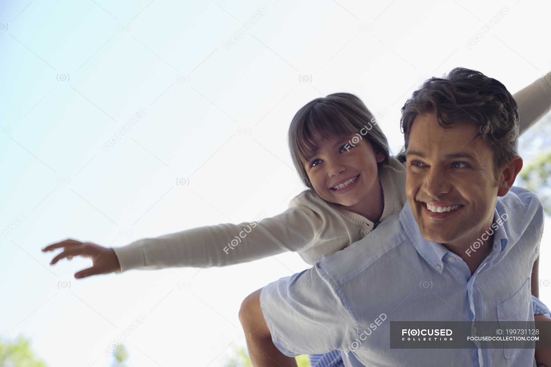 Father and son playing outdoors — brunette, selective focus - Stock ... Father and son playing outdoors — brunette, selective focus - Stock ...