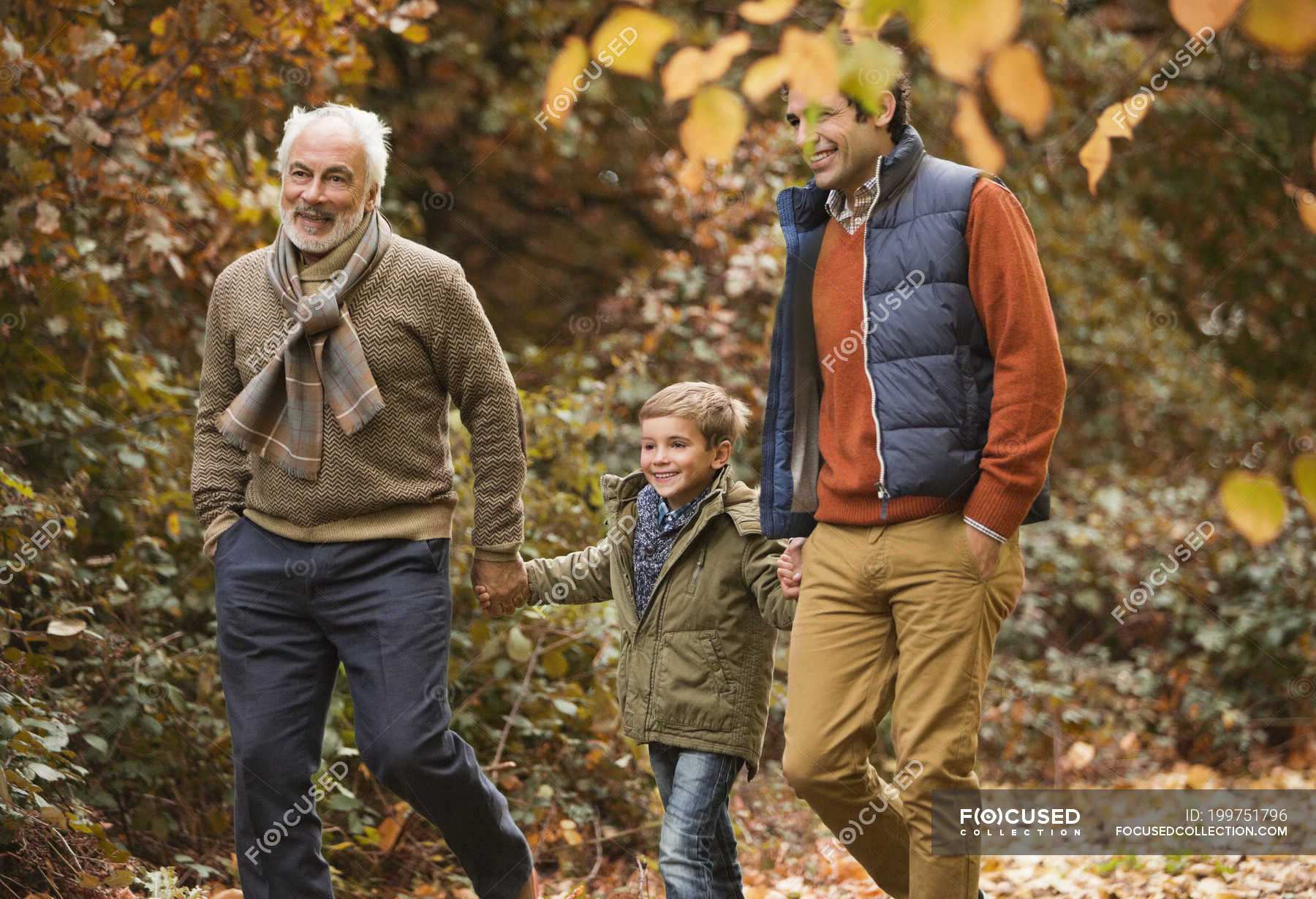 Three generations of men walking in park — man, son - Stock Photo ... Three generations of men walking in park — man, son - Stock Photo ...