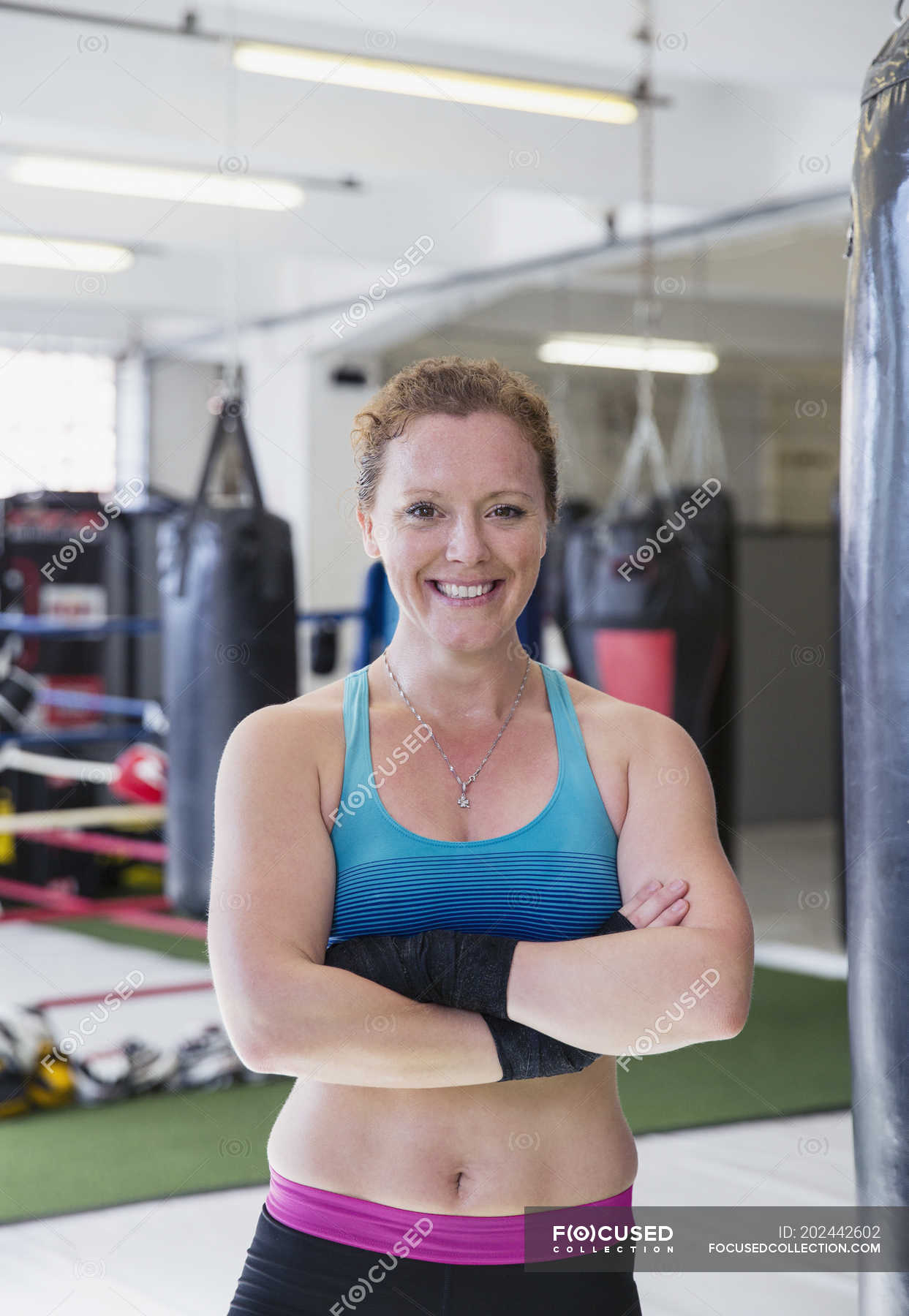 Portrait confident, smiling female boxer in gym — woman, caucasian ... Portrait confident, smiling female boxer in gym — woman, caucasian ...