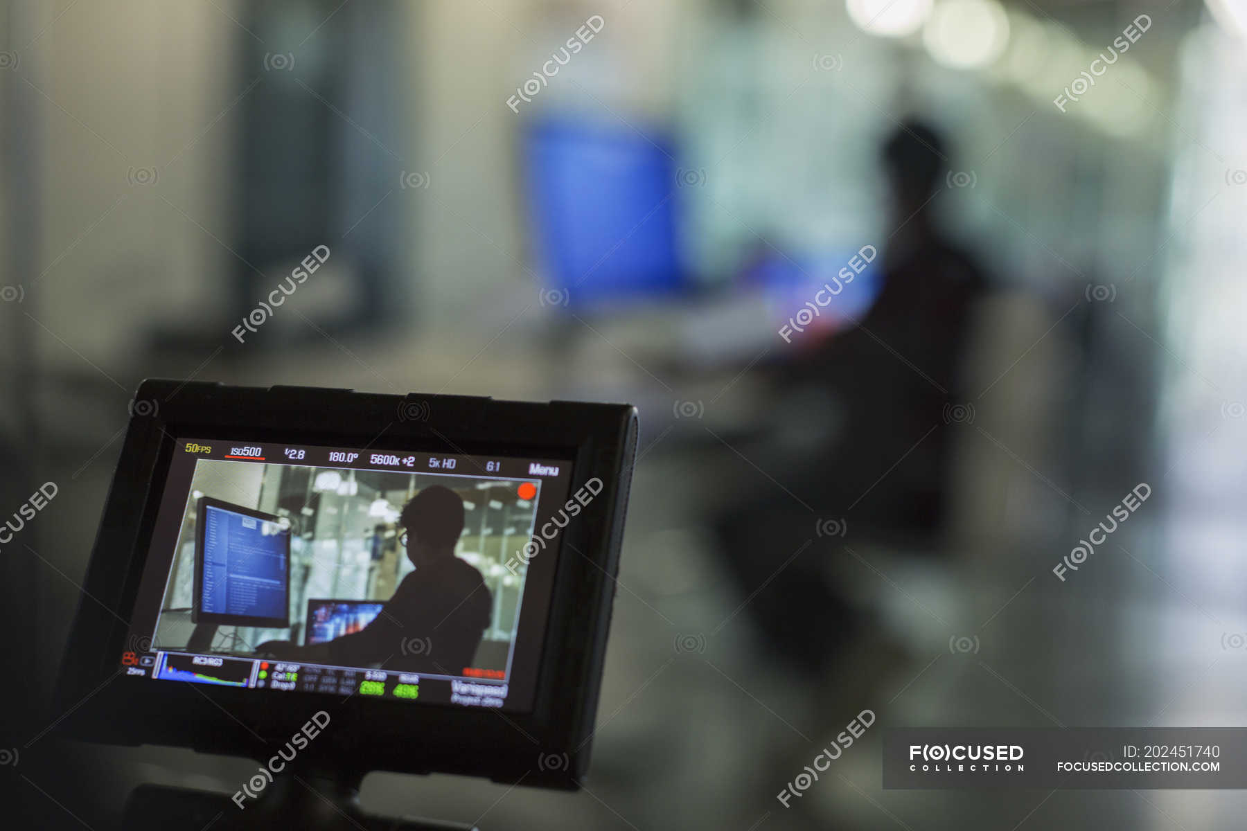 View of boy programming at computer in classroom on digital camera ...