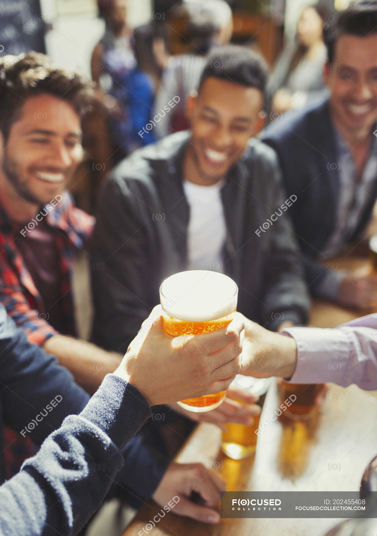 Waiter handing beer to man at bar — High Angle View, friendship - Stock ...