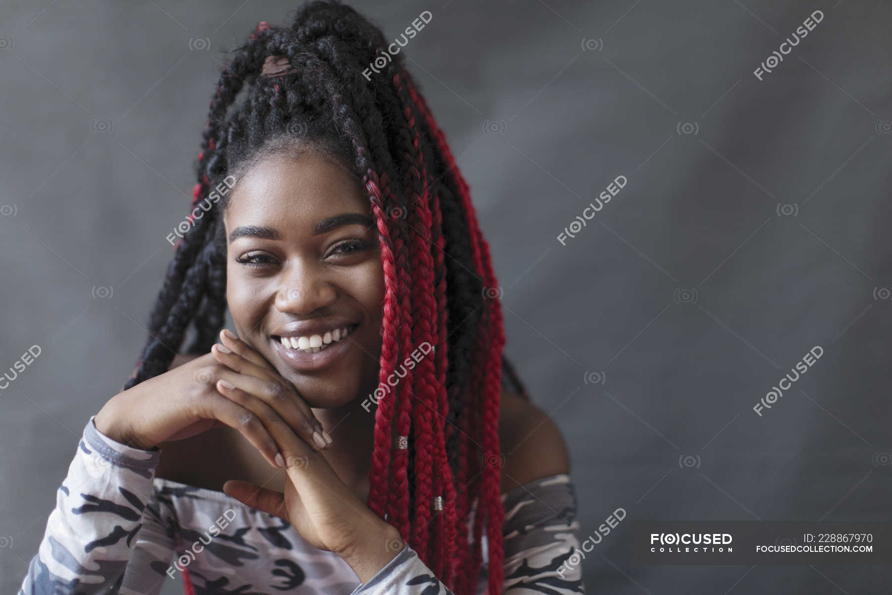 Portrait smiling, confident young woman with red braids — toothy smile ... Portrait smiling, confident young woman with red braids — toothy smile ...