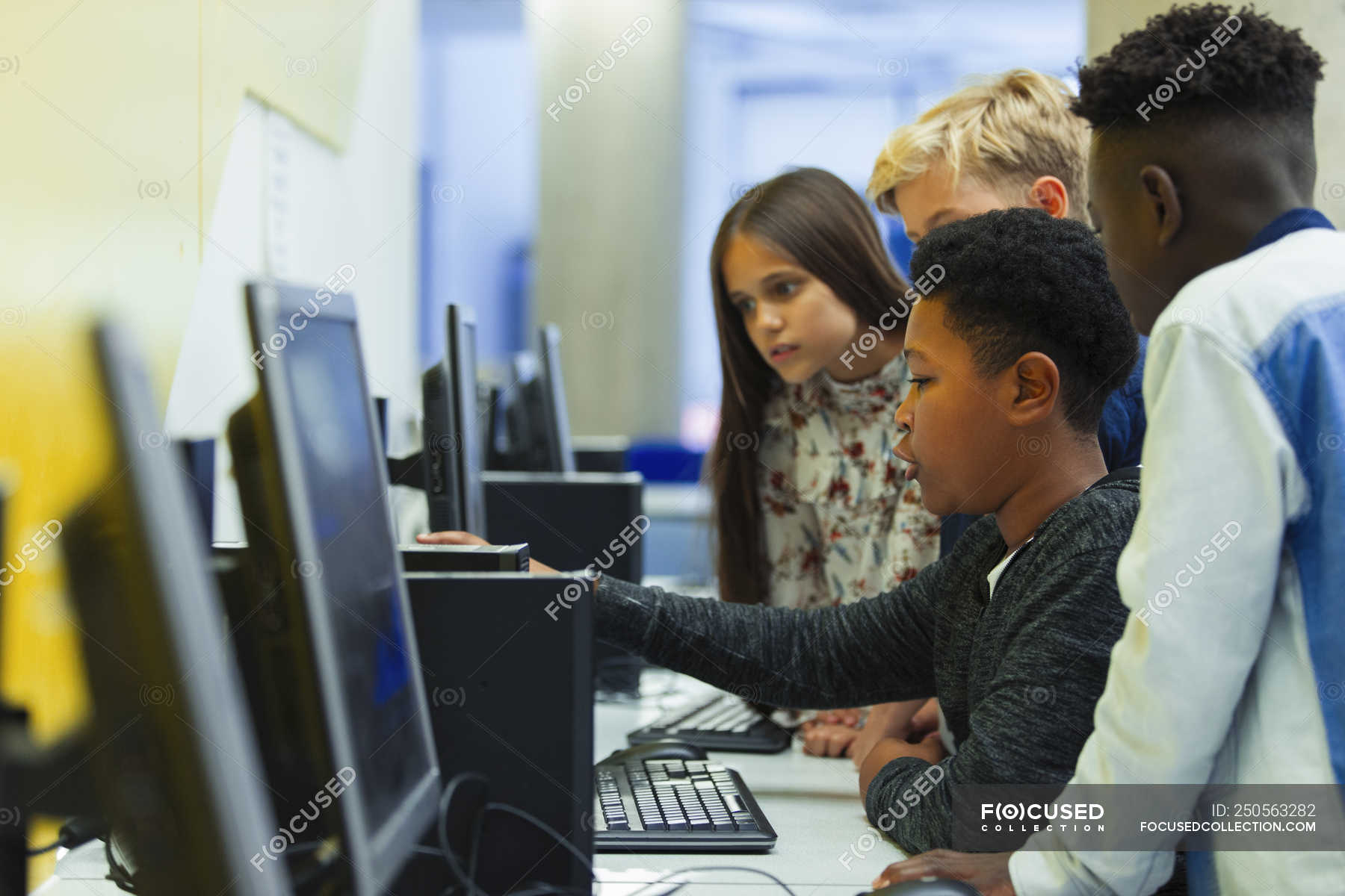 Junior high students using computer in computer lab — classroom ...