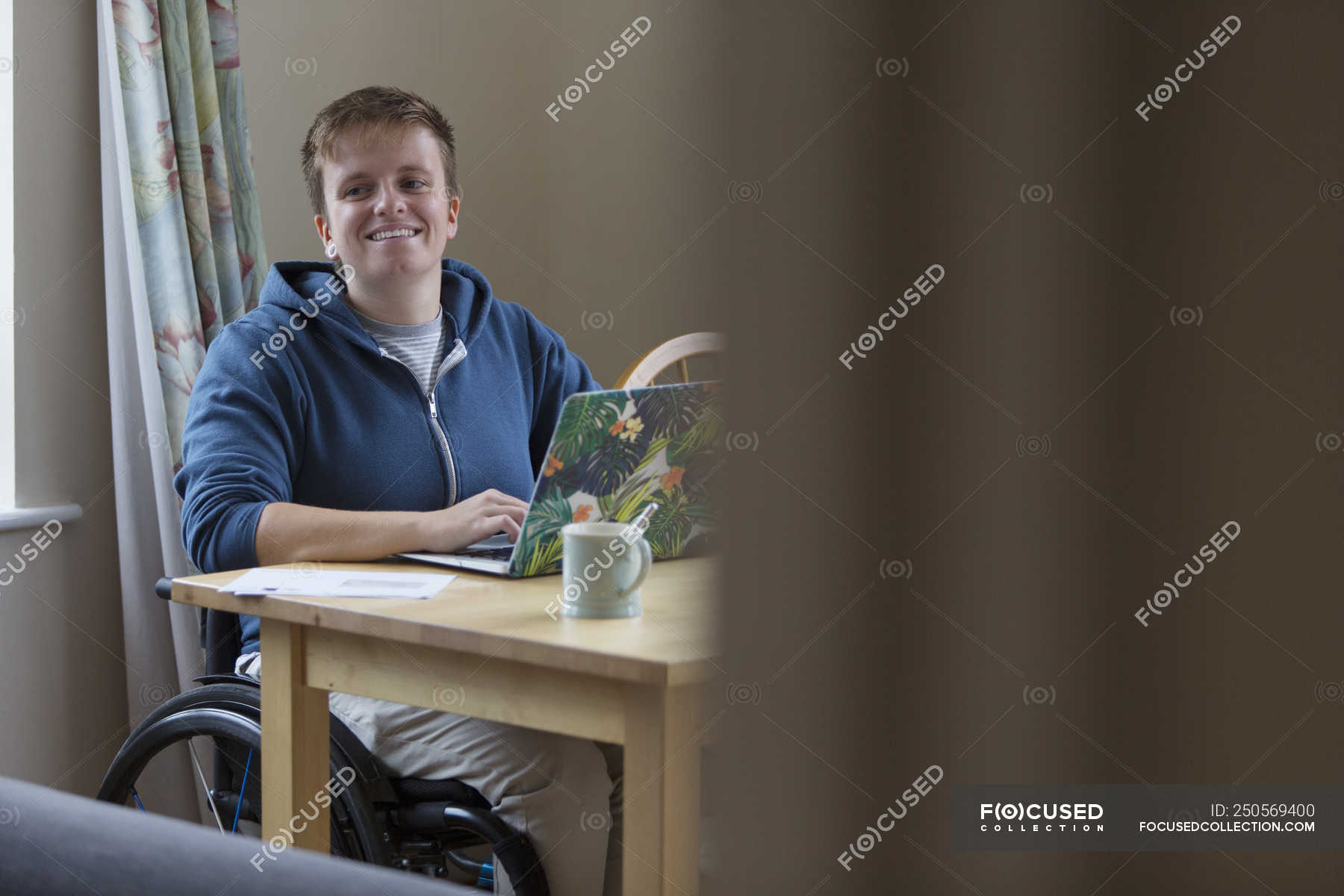 Portrait smiling, confident young woman in wheelchair at laptop — short ... Portrait smiling, confident young woman in wheelchair at laptop — short ...