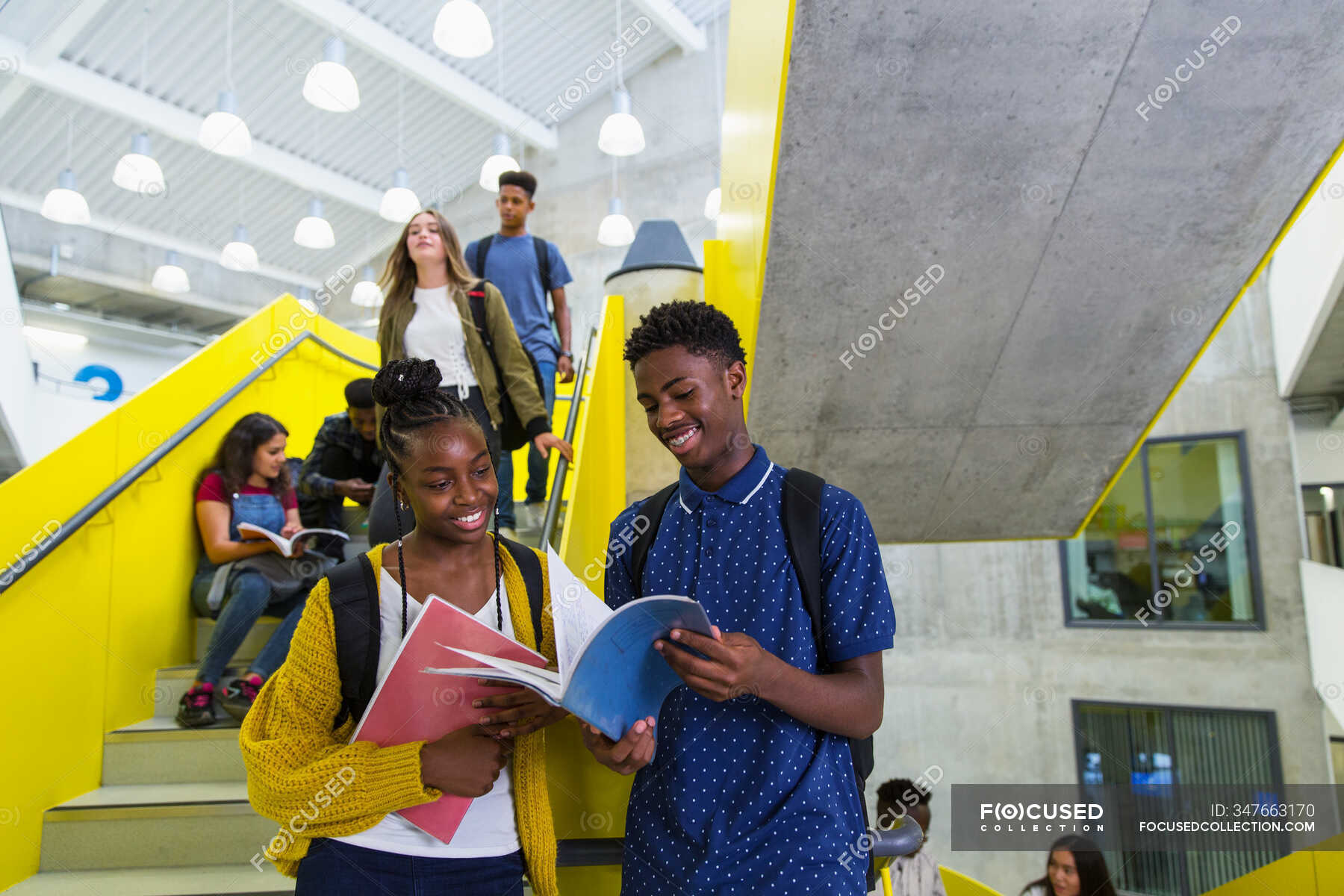 Junior High Students Studying At Stairs Corridor African Ethnicity junior-high-students-studying-at-stairs-corridor-african-ethnicity