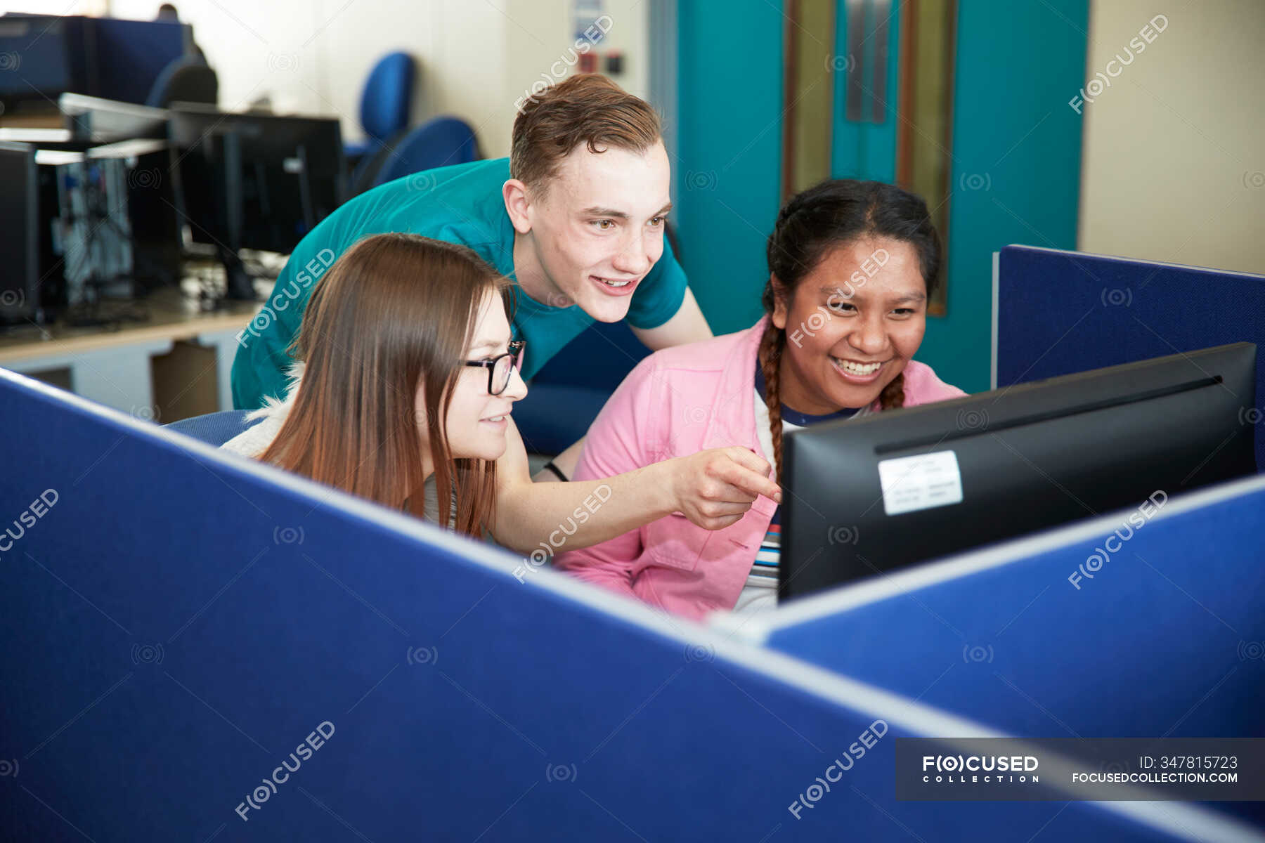 College students using computer in classroom — watching, technology ...