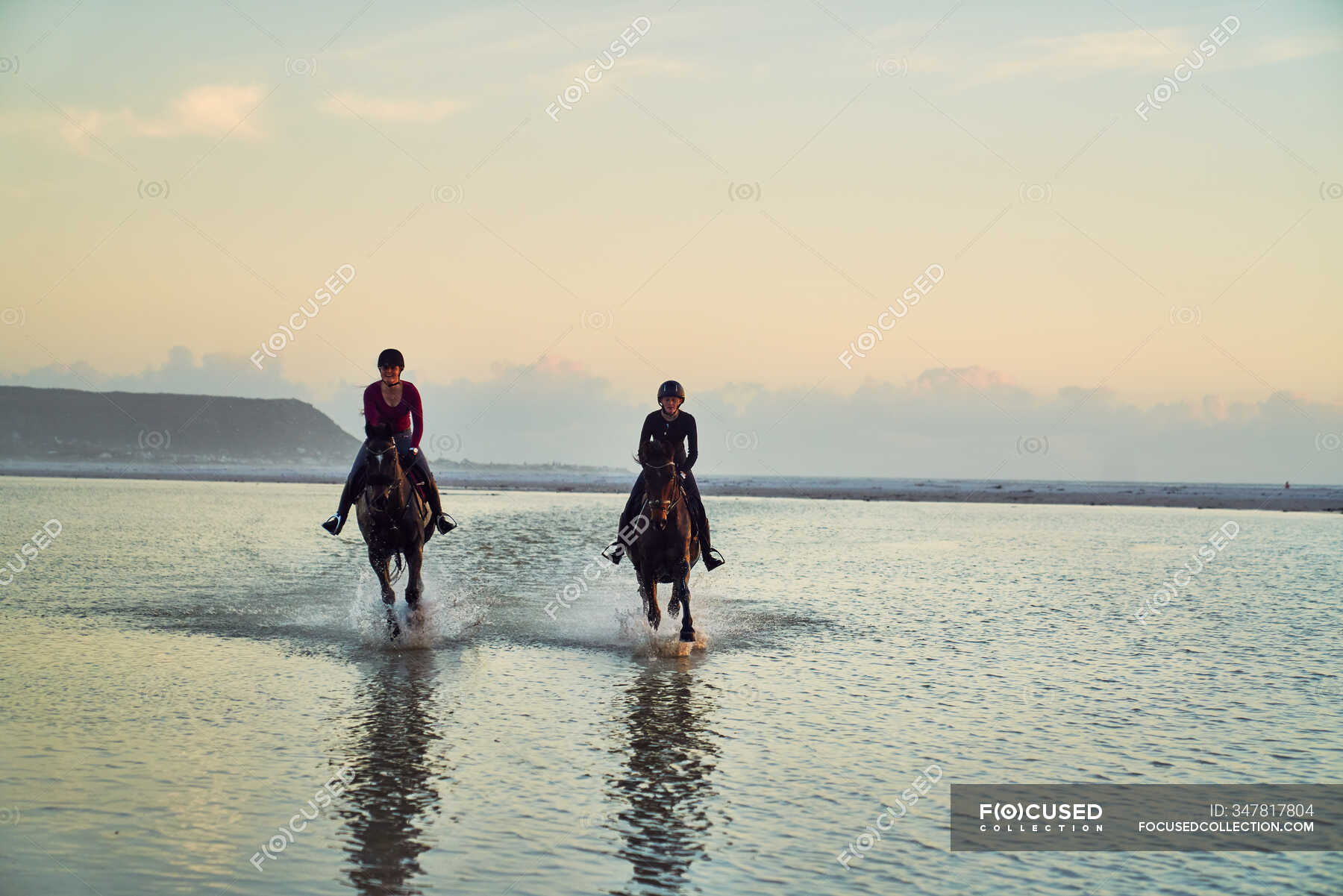 Young women horseback riding in ocean surf — beach, portrait - Stock ... Young women horseback riding in ocean surf — beach, portrait - Stock ...