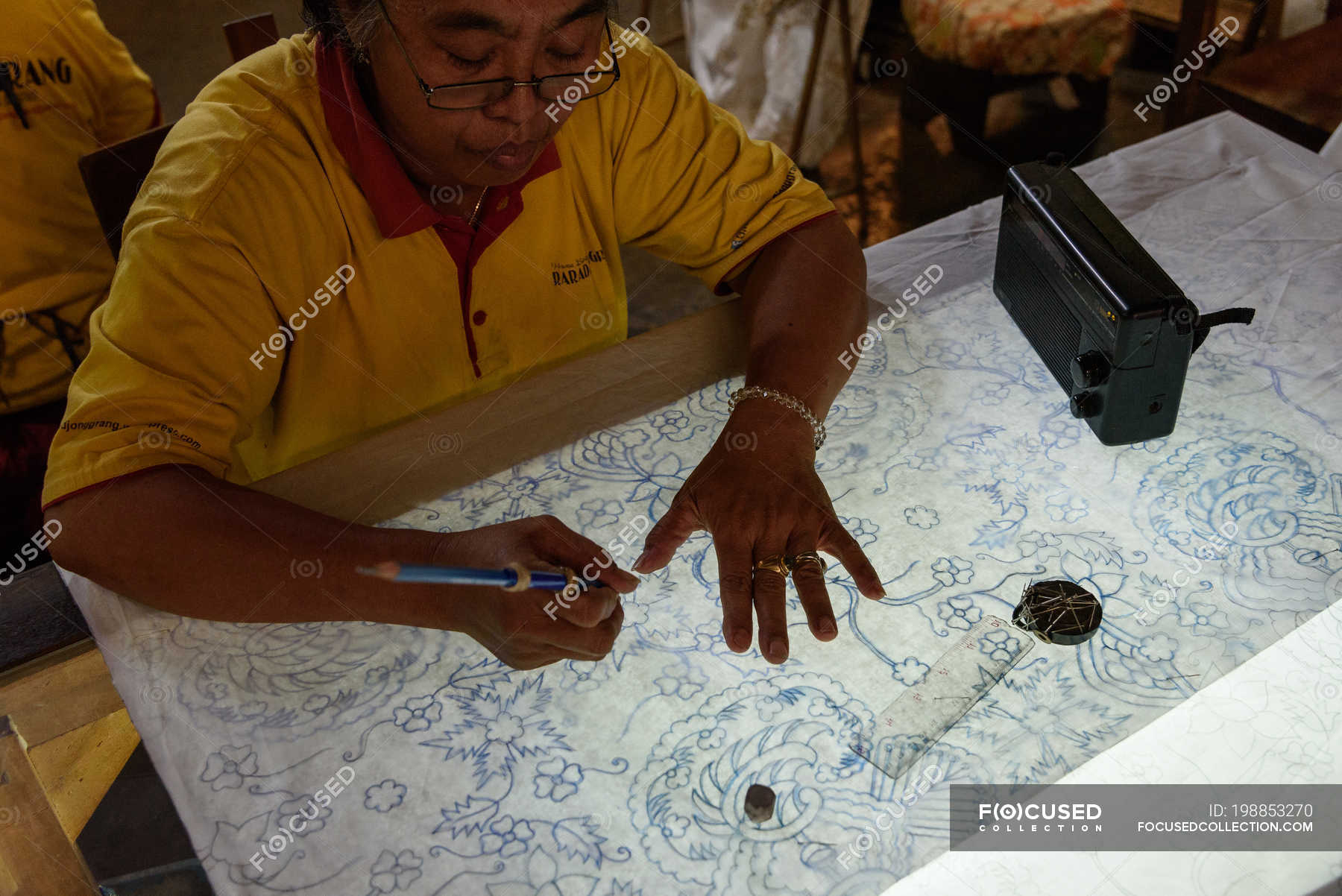 Indonesia, Java, Yogyakarta, woman specializes in textiles and batik ...