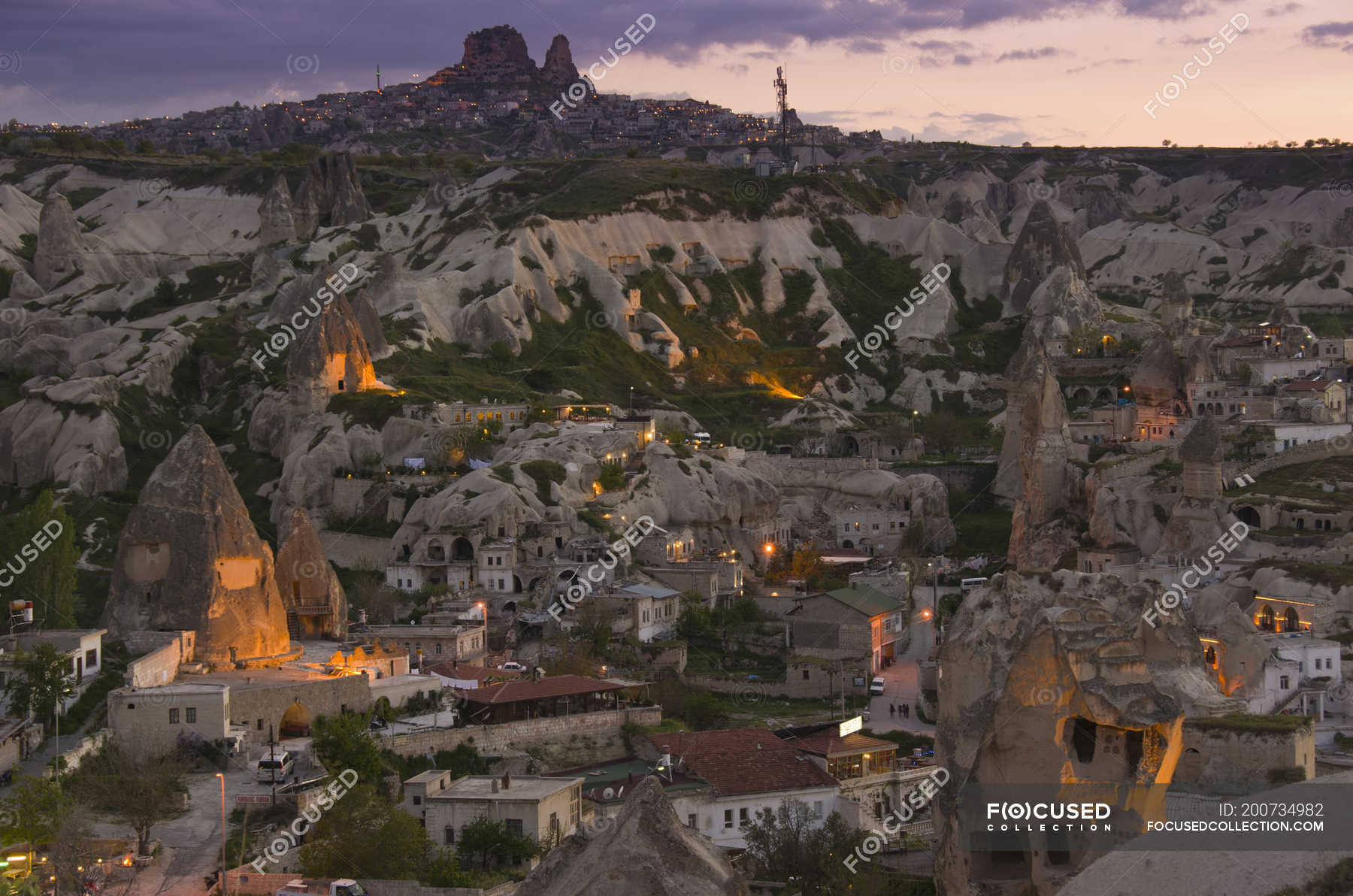 Townscape and fairy chimneys of Goreme at sunset, Cappadocia, Turkey ...
