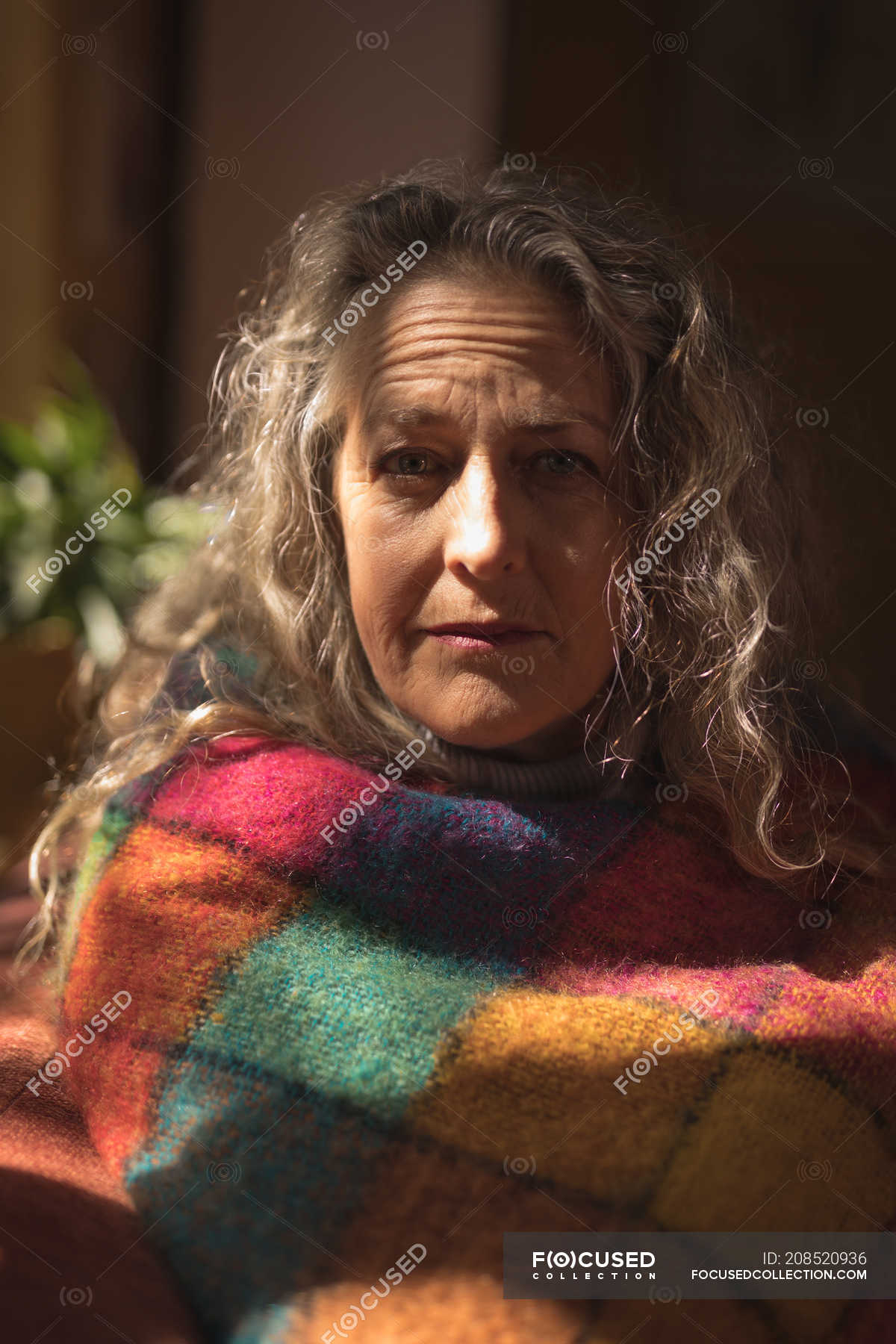 Close up Portrait Of Mature Woman Wrapped In Blanket 50s Caucasian close-up-portrait-of-mature-woman-wrapped-in-blanket-50s-caucasian