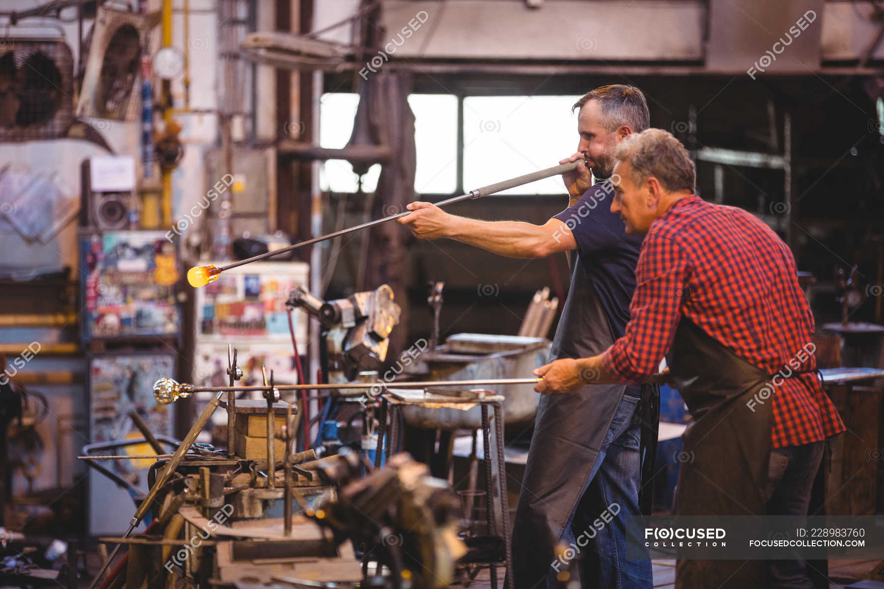 Glassblowers Shaping A Glass On The Blowpipe At Glassblowing Factory — Hand Tool Artwork
