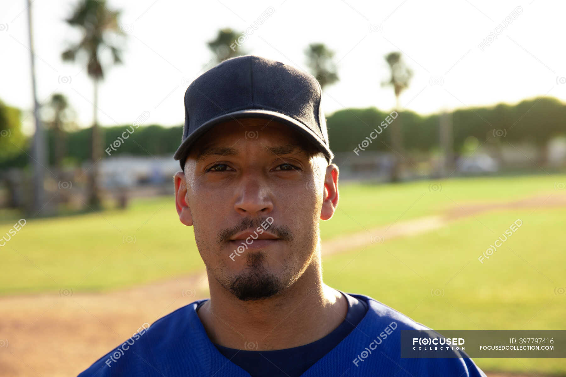 Portrait of a mixed race male baseball player, wearing a team uniform ... Portrait of a mixed race male baseball player, wearing a team uniform ...