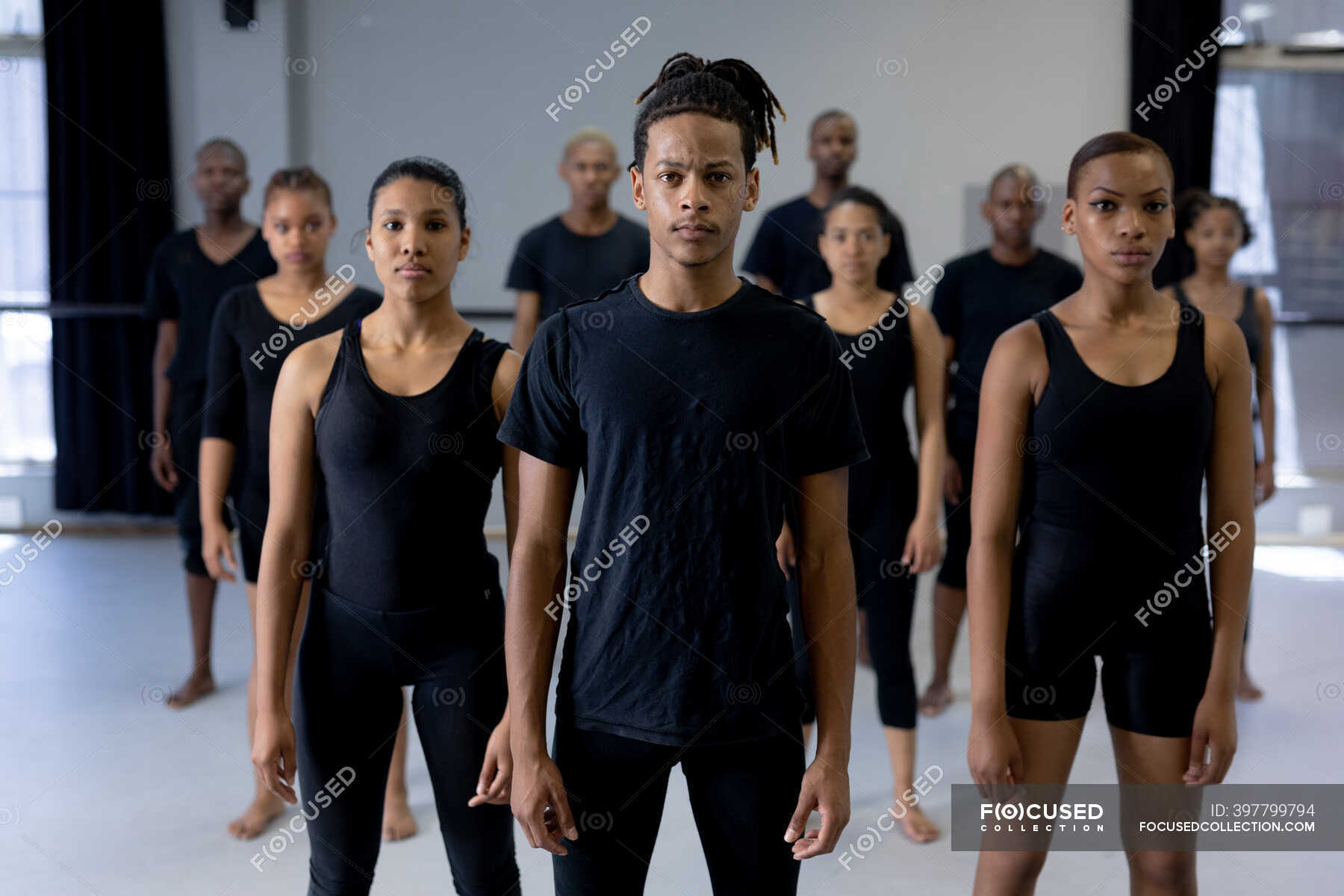 Front View Of A Mixed Race Modern Male Dancer Wearing Black Clothes