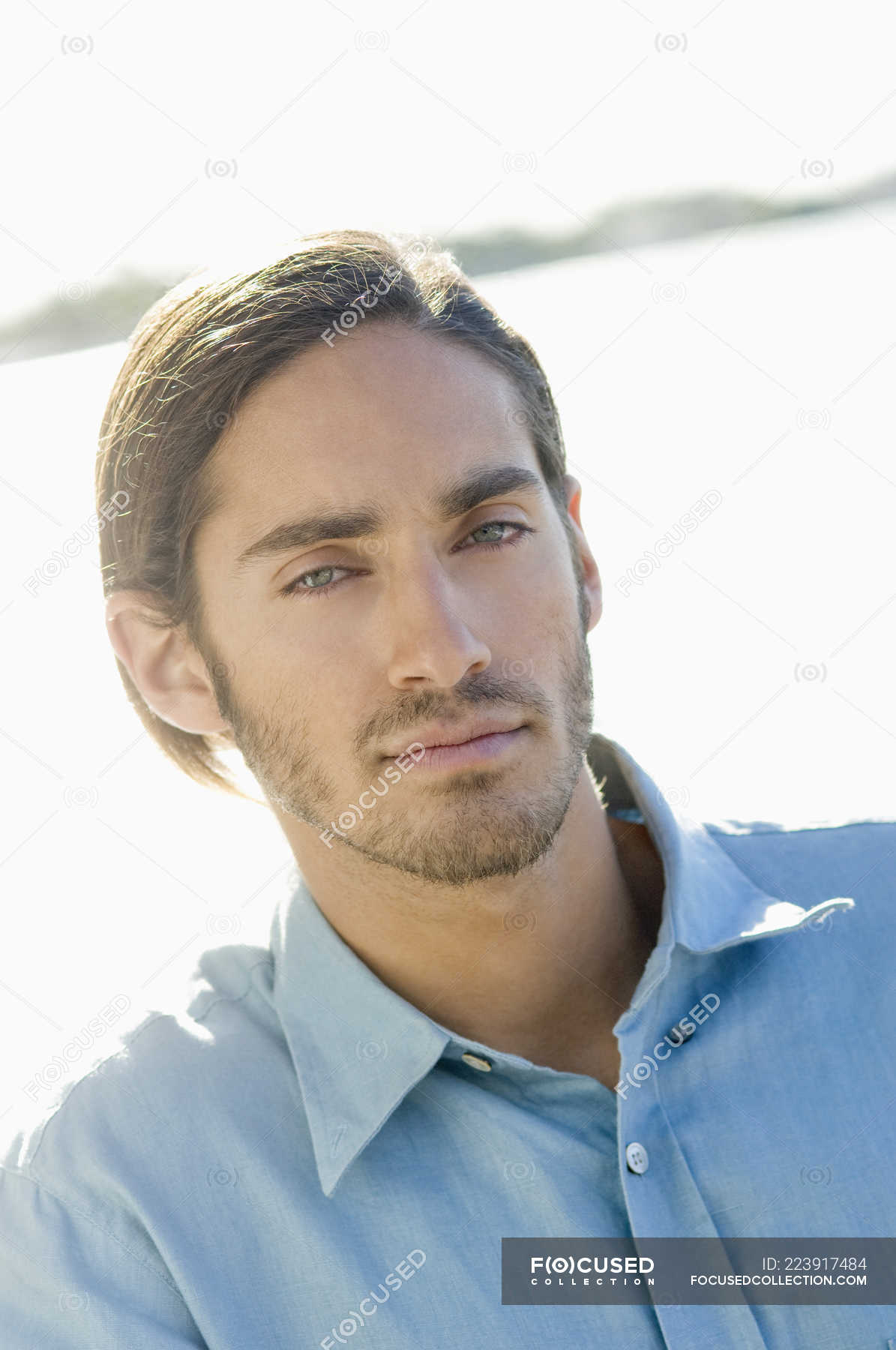 Portrait of handsome young man outdoors — serious, brown hair - Stock ...