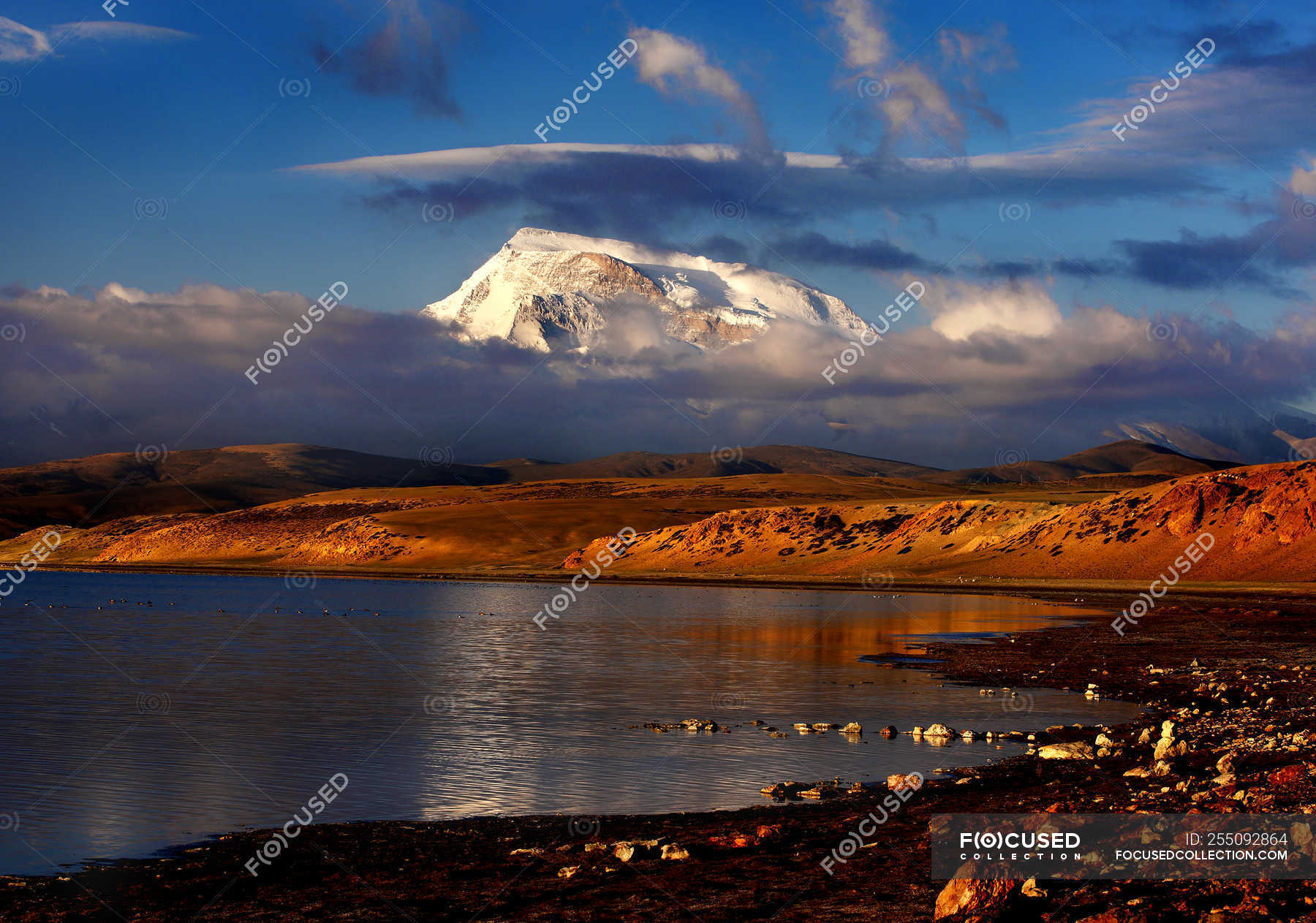Amazing mountain landscape with snow-covered mountains and clouds in ...