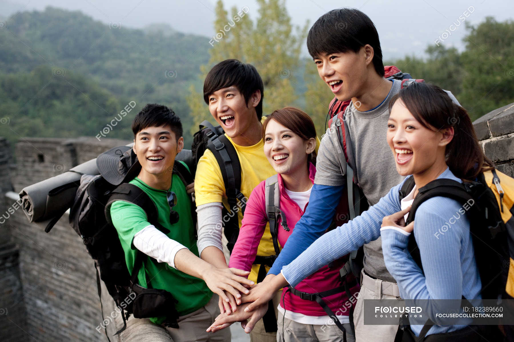 Chinese hikers stacking hands and on Great Wall — sport, travel destination - Stock Photo ...