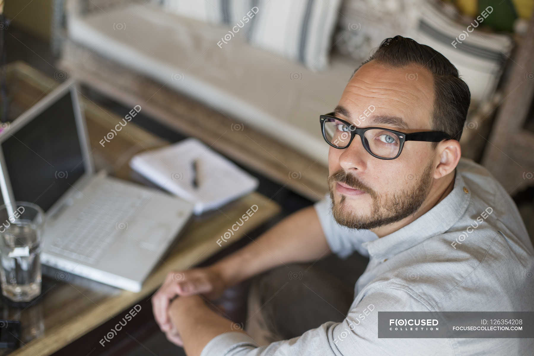 Man sitting and using a laptop computer. — desk, people - Stock Photo ...