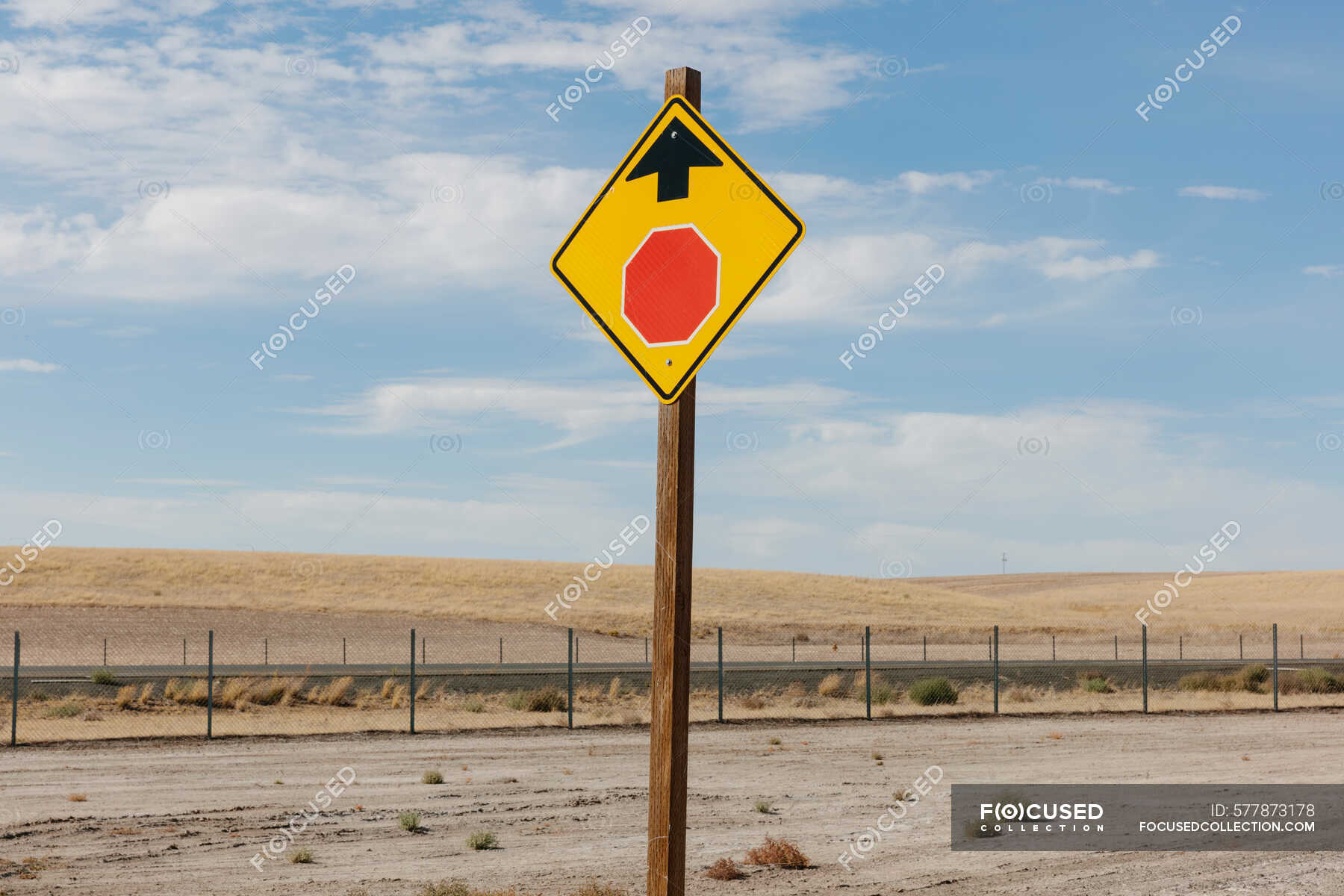 Stop Sign ahead, a yellow sign and red circle with arrow, roadside ...
