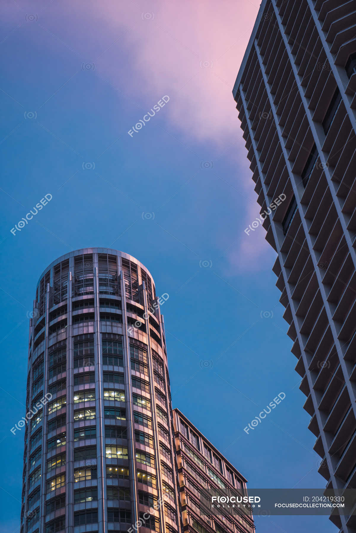 High-rise buildings on background with clear evening sky, Singapore ...