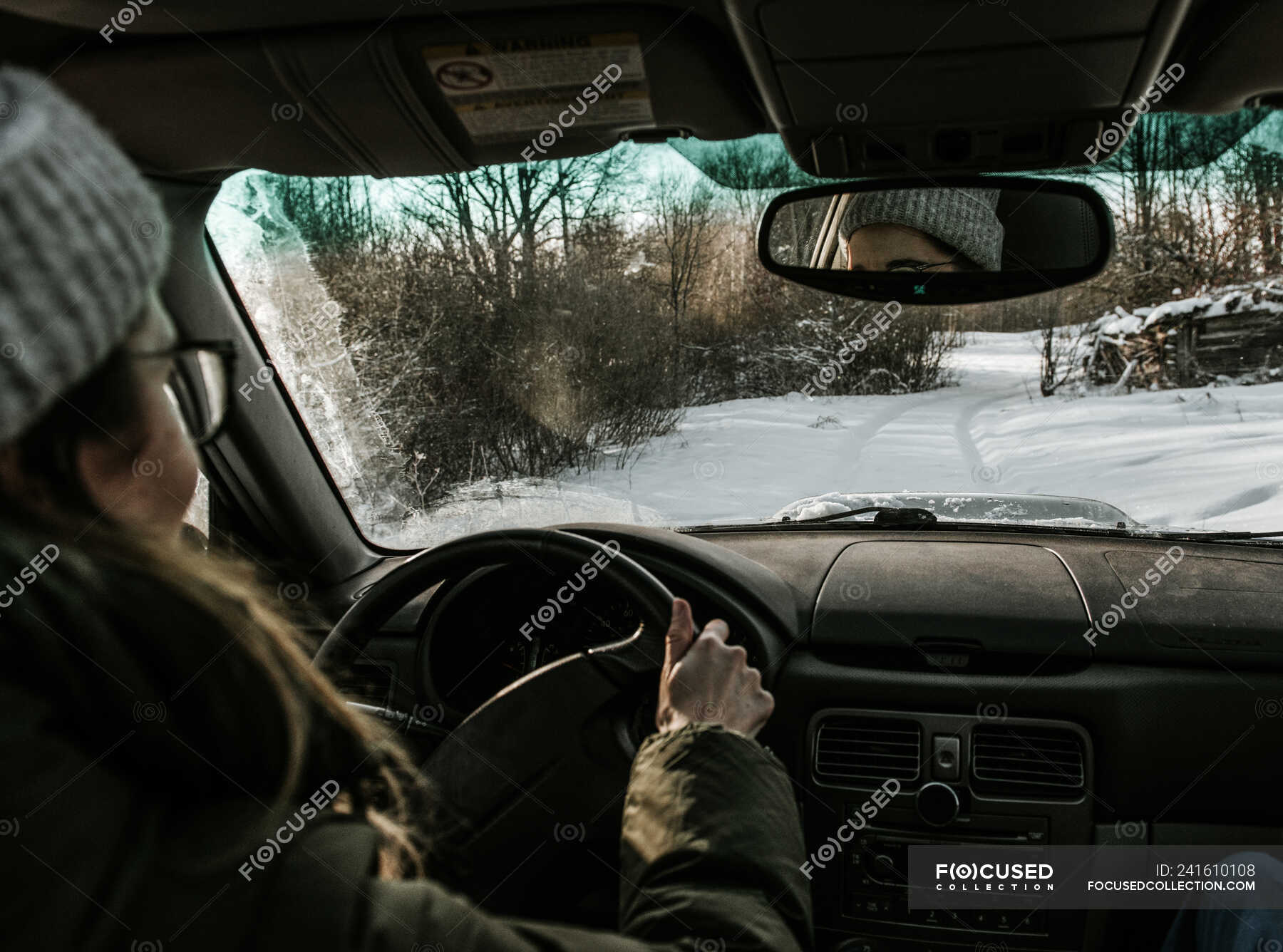Woman driving car on snow field — people, anonymous - Stock Photo ...