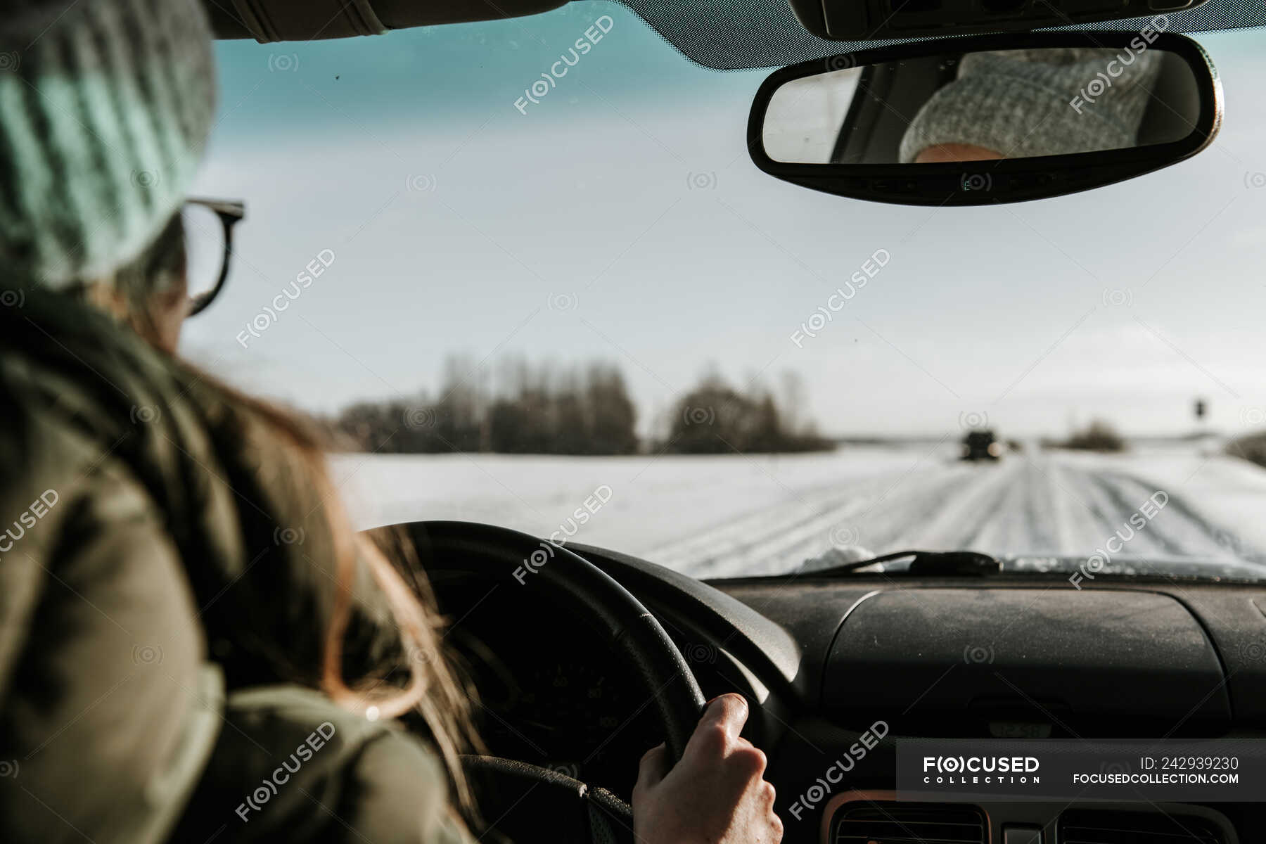 Woman driving car on snow field — faceless, unrecognizable - Stock ...