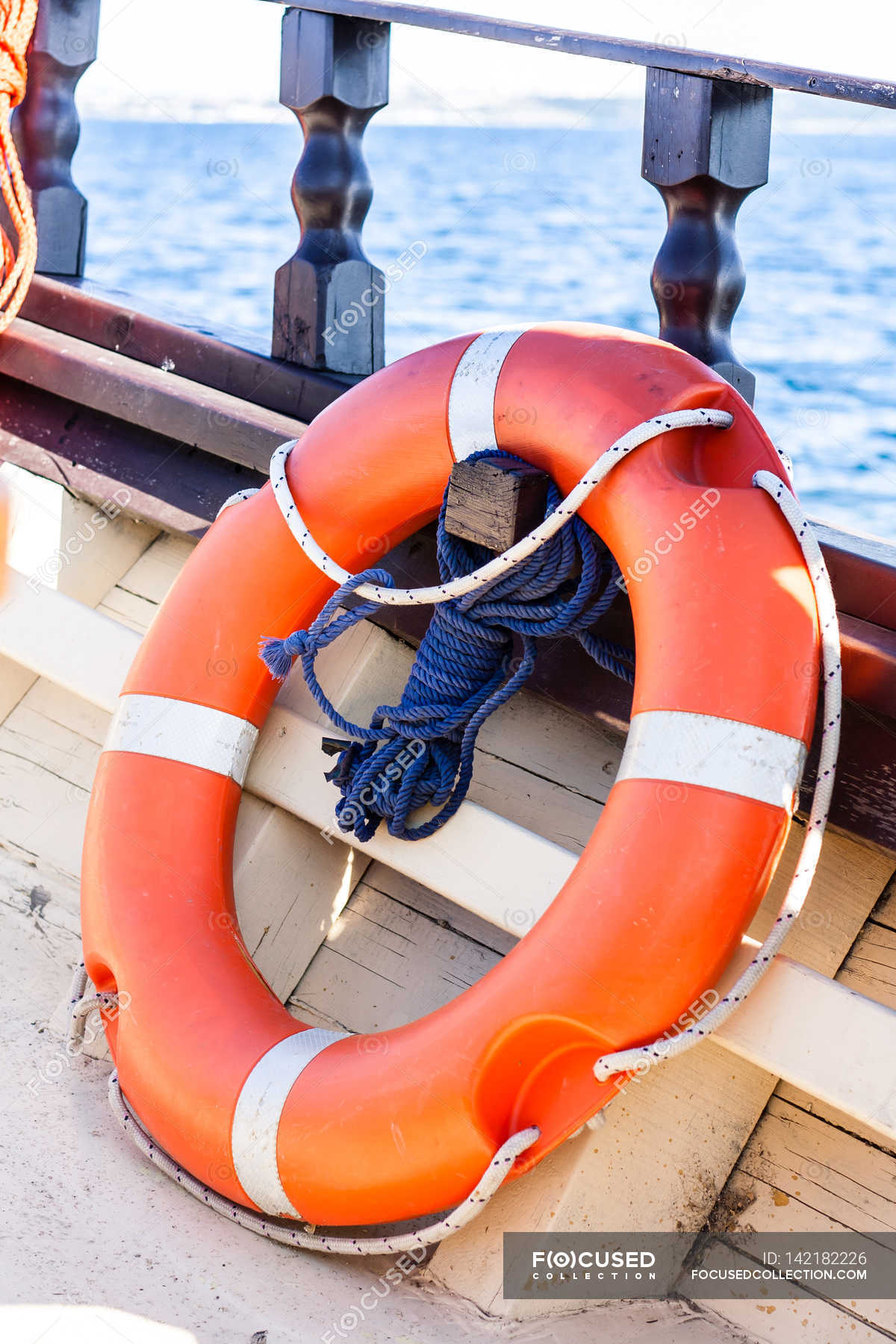 Orange life buoy on boat — sea, safety - Stock Photo | #142182226 Orange life buoy on boat — sea, safety - Stock Photo | #142182226