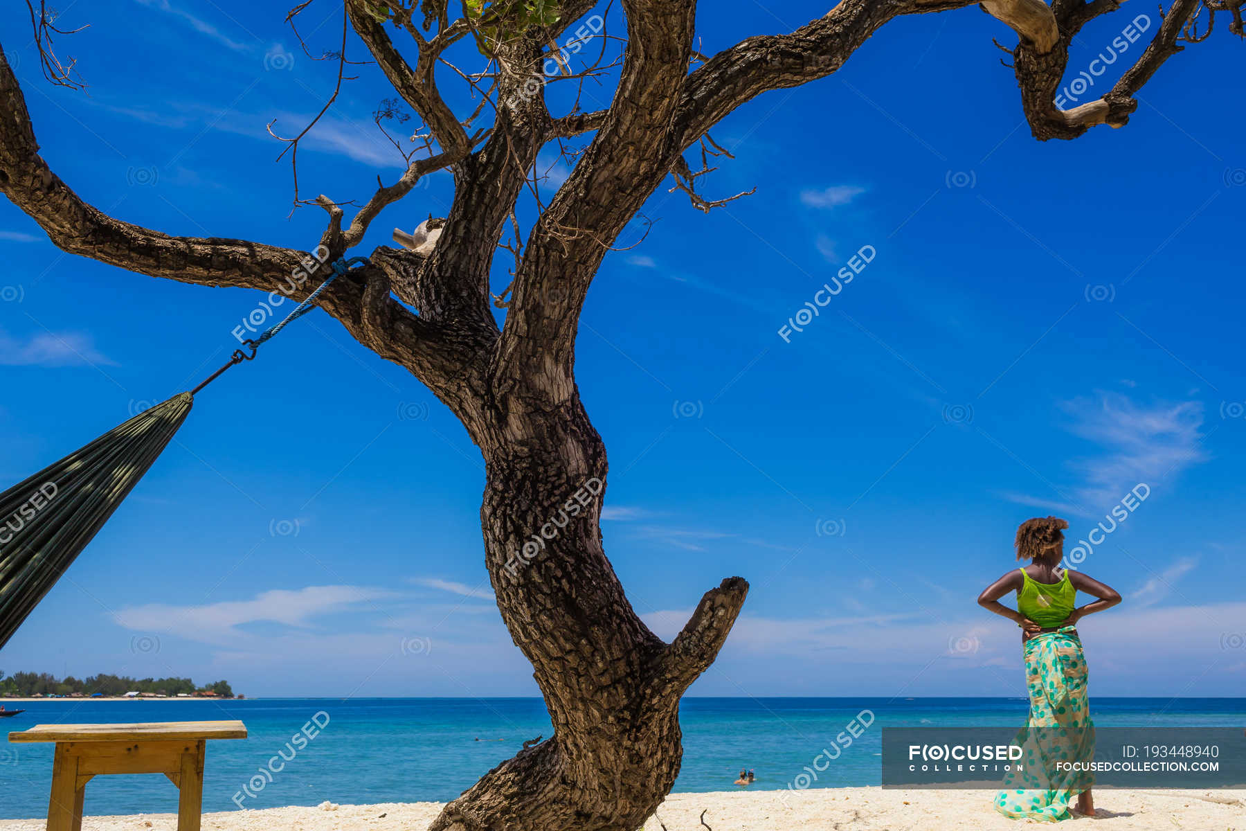 Girl Standing On Beach And Looking At Ocean Indonesia — Solitude Blue