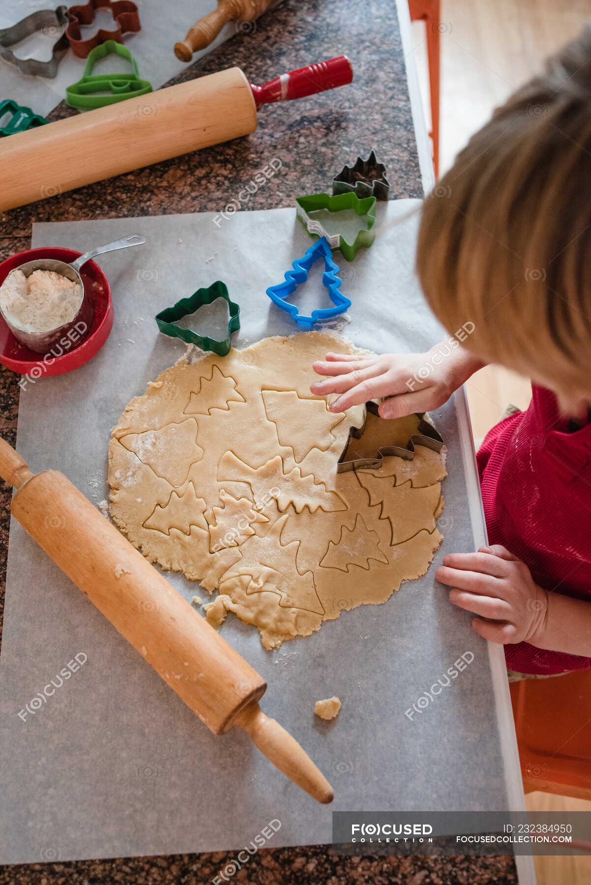 Boy making Christmas cookies — festive, child - Stock Photo | #232384950